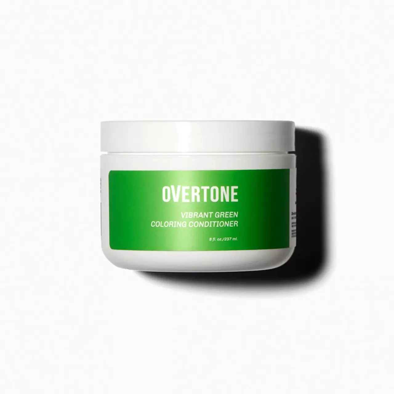 basen Overtone Vibrant Green Coloring Conditioner sou background blan